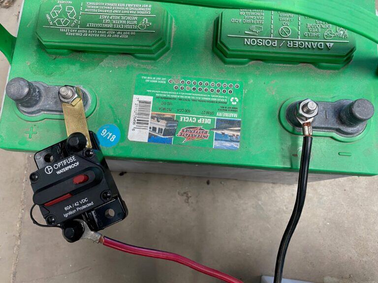 How does the circuit breaker connect to the battery?